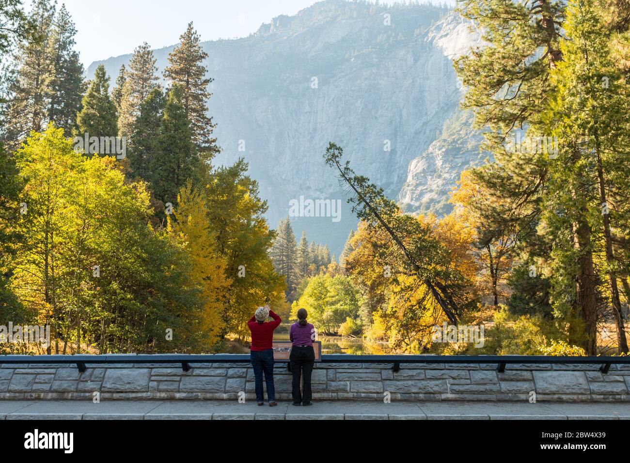 Two tourists observe and photograph the landscape from the Sentinel ...