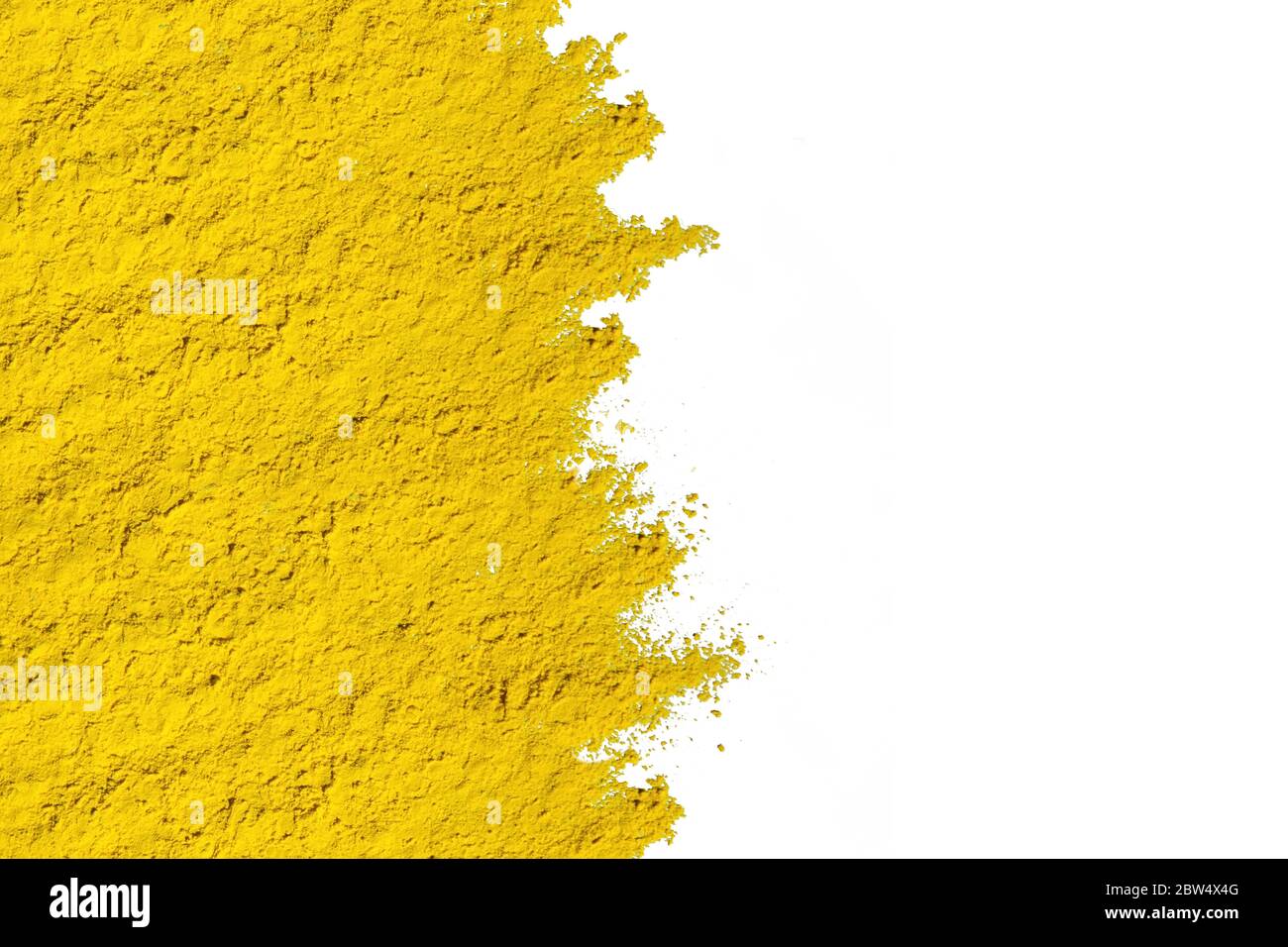Abstract background of yellow dry powder paint. Copy space in a right ...