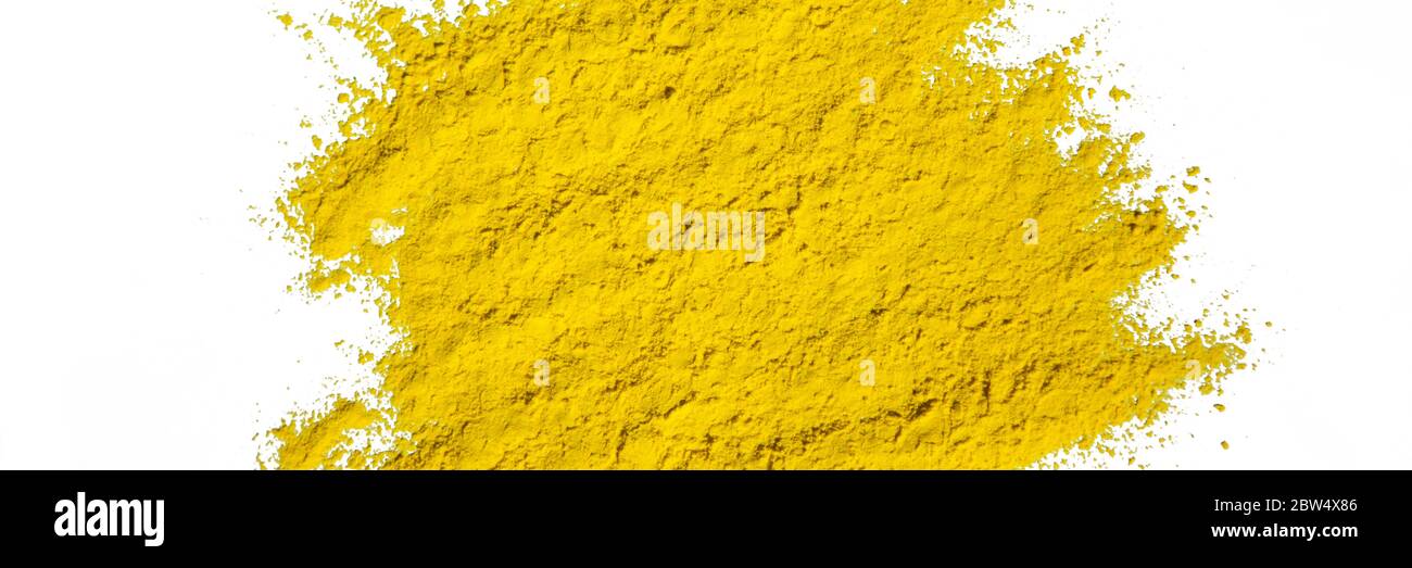 Abstract background of yellow dry powder paint. Copy space in a center ...