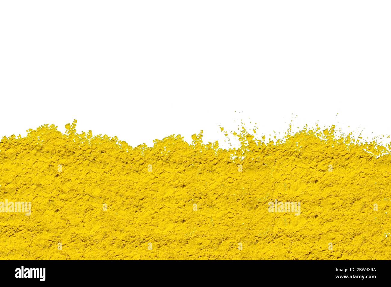 Abstract background of yellow dry powder paint. Copy space in a center ...