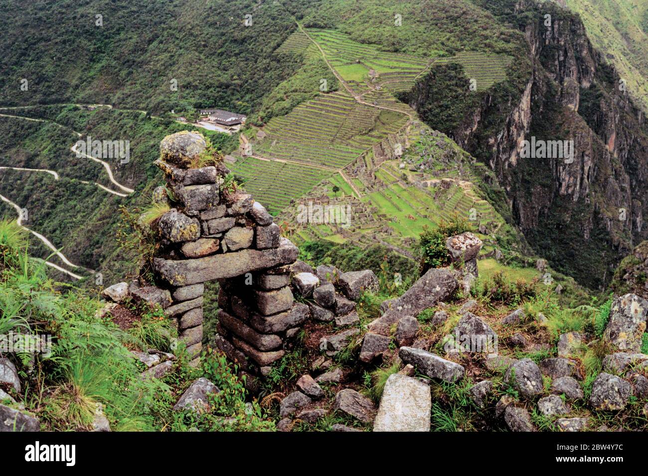 Stone walls ruins from doorway and agricultural terraces in the ancient ...