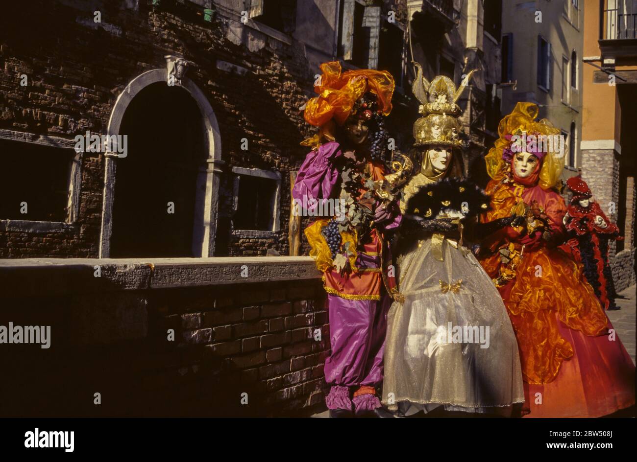 Carnival revelers wearing colorful and sophisticated costumes with ...