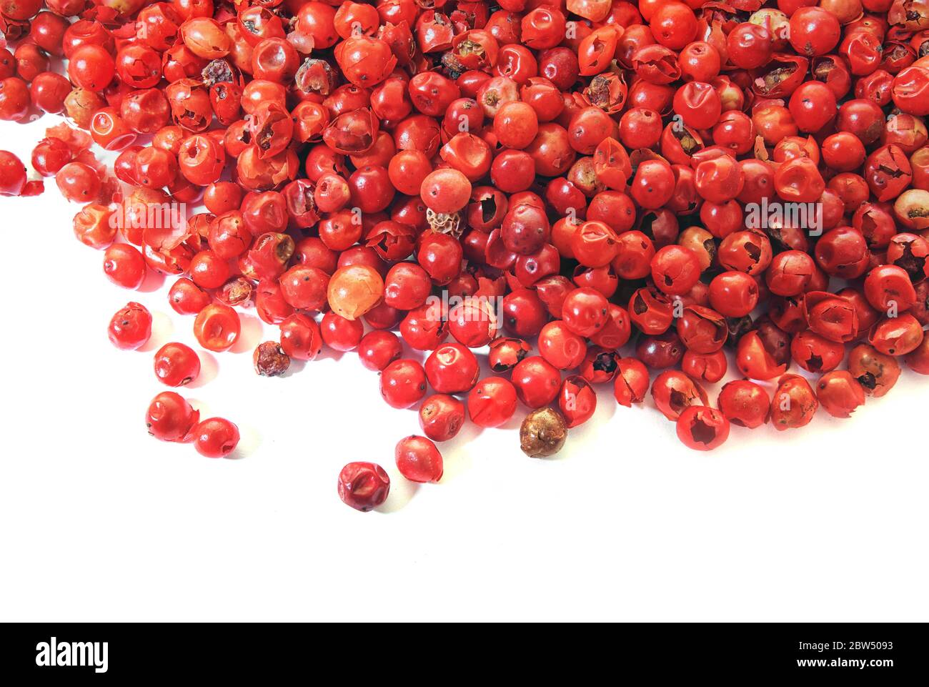 pink peppercorn close up , on white background Stock Photo - Alamy