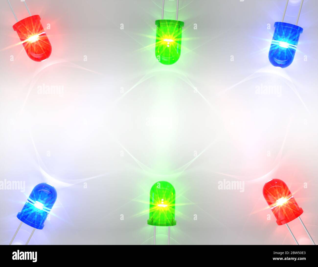 Shiny RGB LEDs emitting caustic lights on a diffuse white background ...