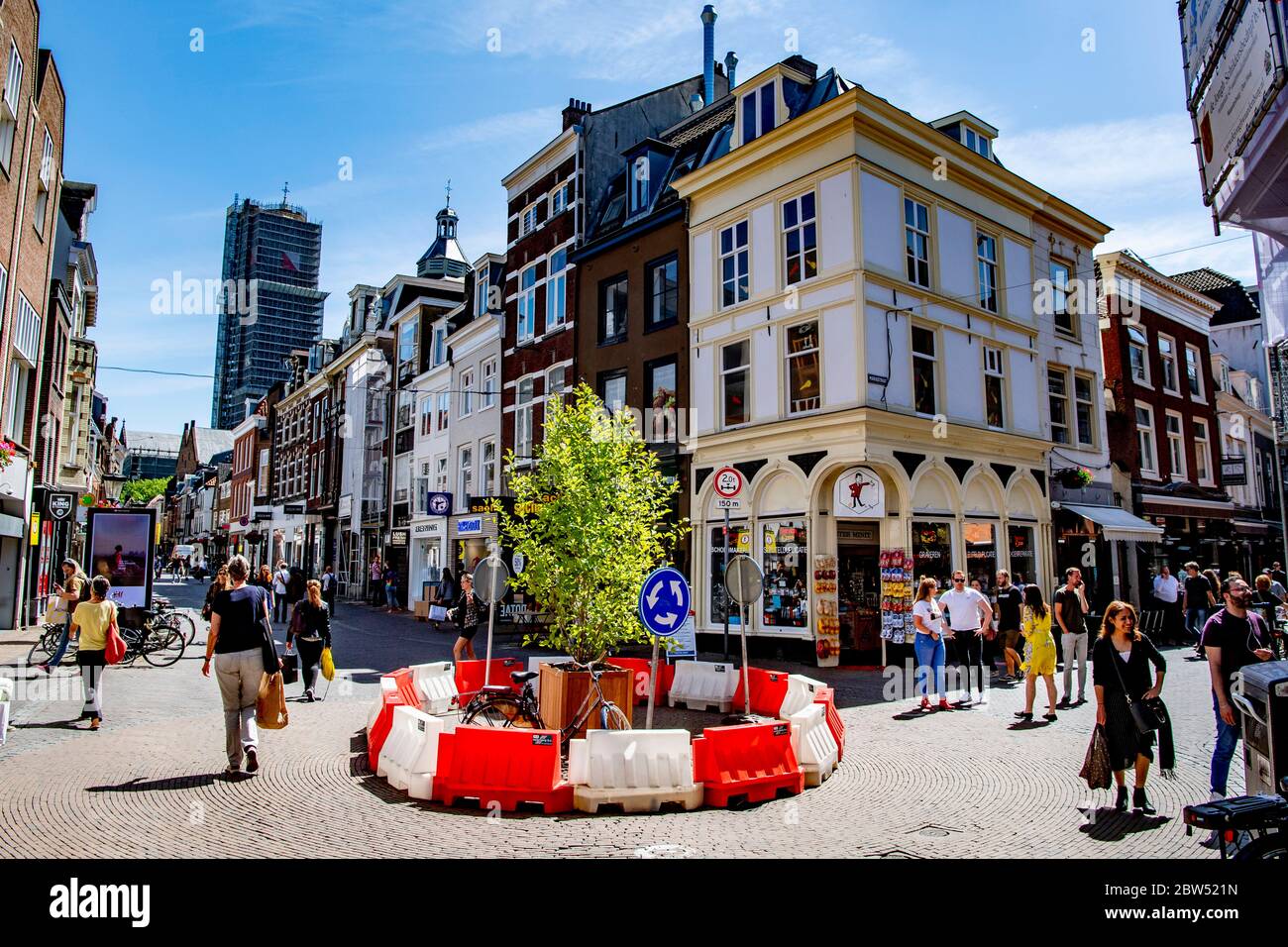 One-way signs and arrows on a road close to a roundabout in the centre ...