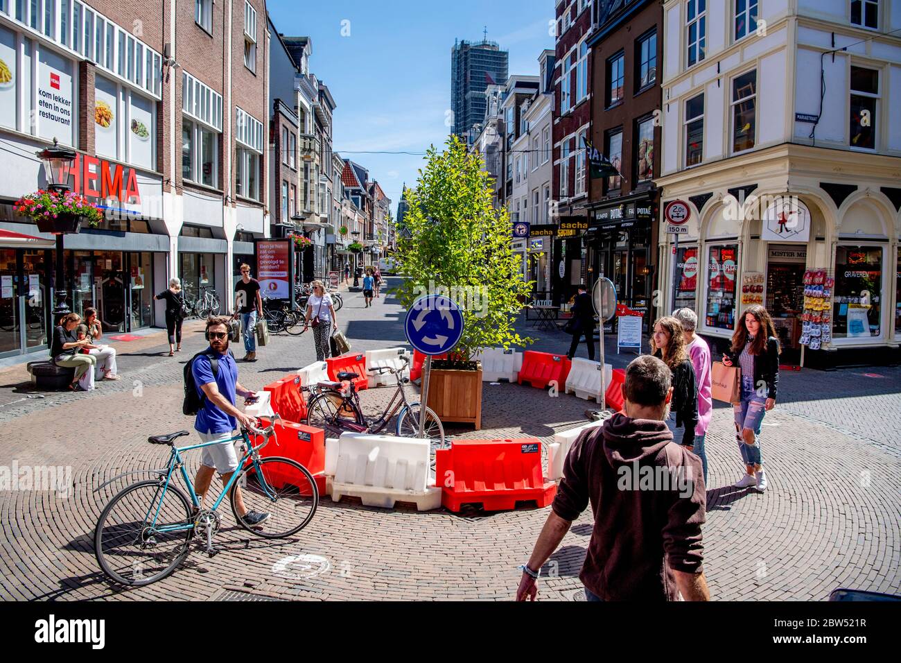 One-way signs and arrows on a road close to a roundabout in the centre ...