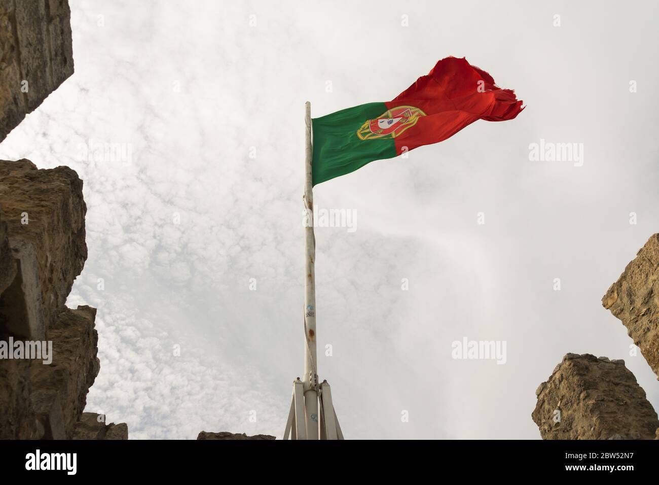 Flag of Portugal (red, yellow and green), Lisbon. Low angle shot taken ...