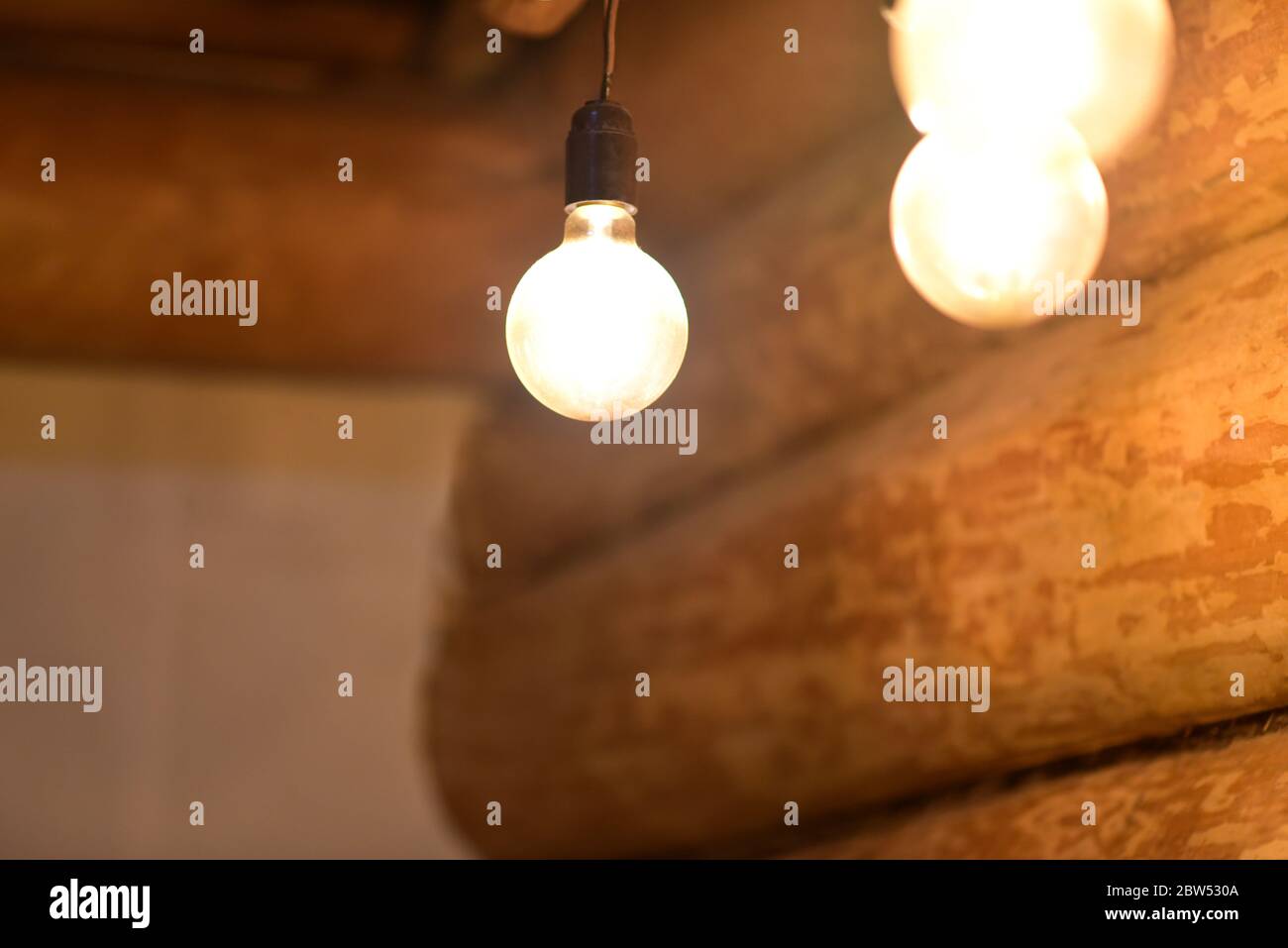 Old incandescent light bulb in a wooden house Stock Photo - Alamy