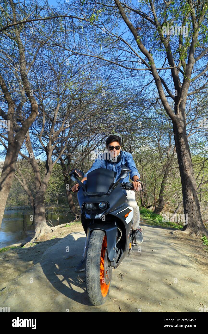 Stylish male model with motorcycle or sports bike Stock Photo - Alamy