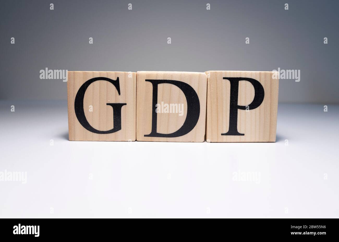 Gdp word in spot light on white background. Close up Stock Photo - Alamy