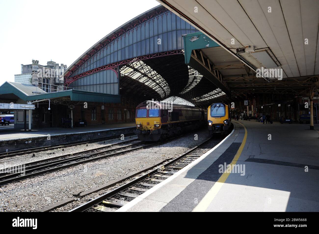 66194 brings a loaded M.G.R. through Bristol Temple Meads alongside an ...