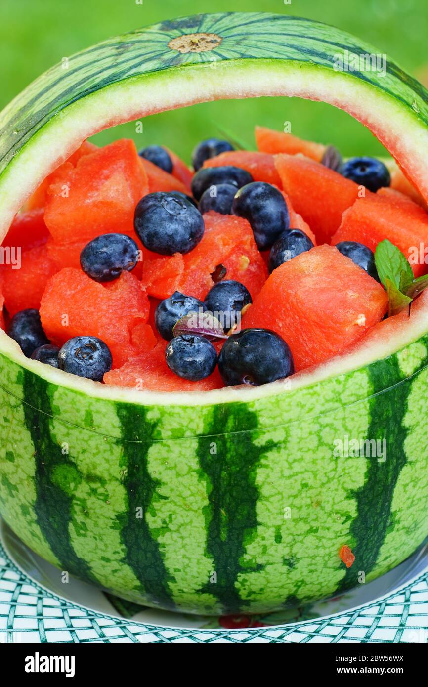 Watermelon and blueberry salad in a watermelon basket Stock Photo - Alamy