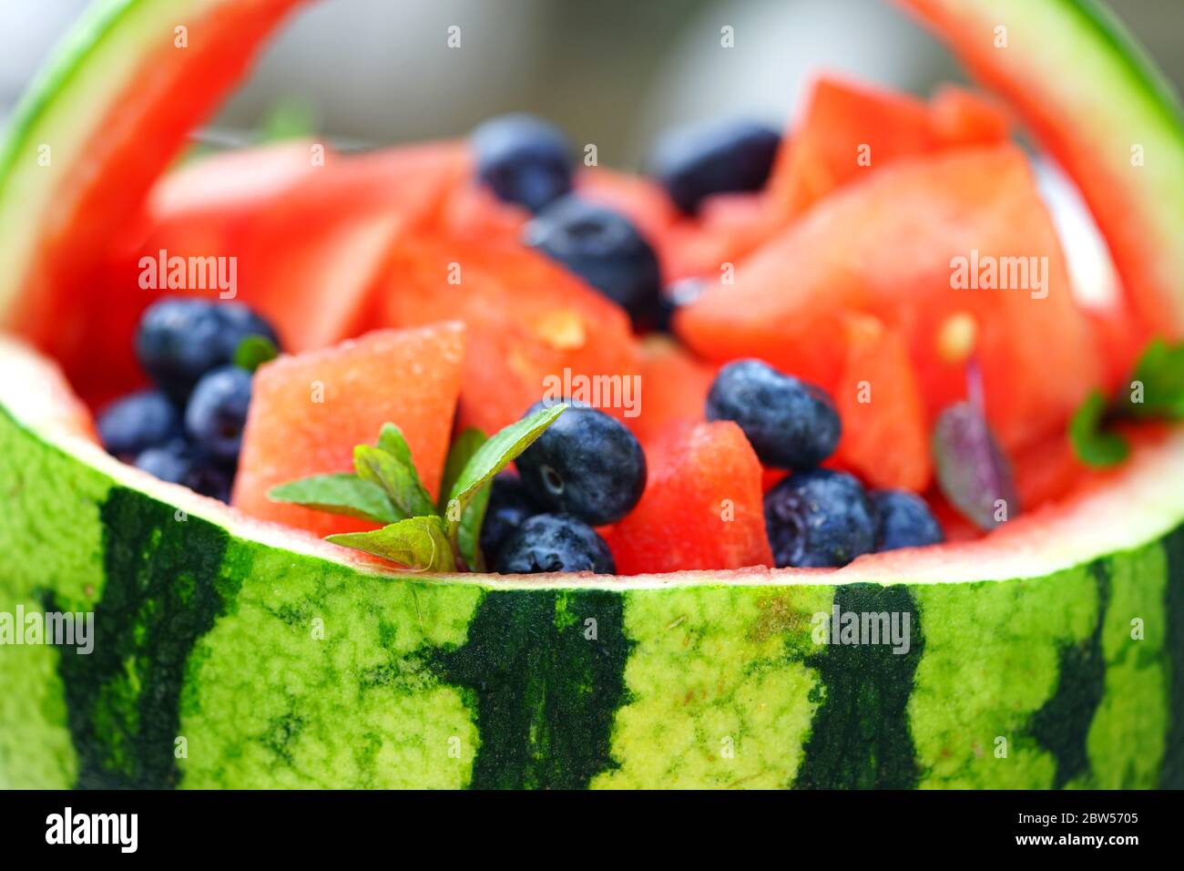Watermelon and blueberry salad in a watermelon basket Stock Photo - Alamy