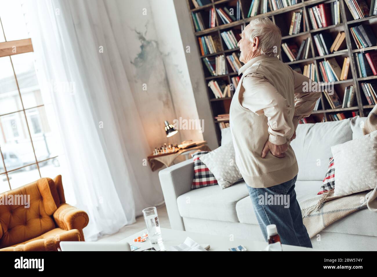 Tired old man having back hi-res stock photography and images - Alamy