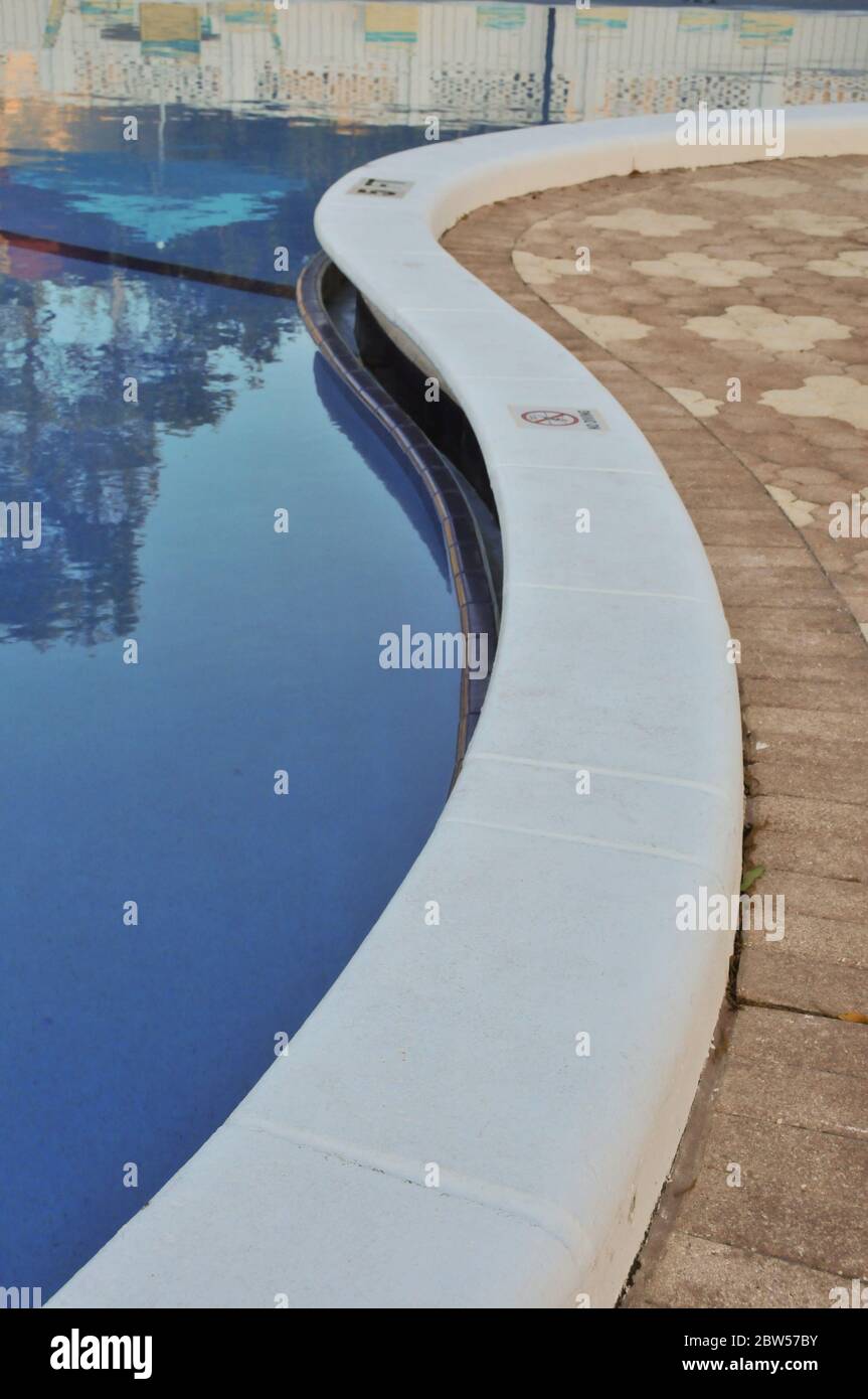 Vertical phot of a pool with the deck in the shape of an "s Stock Photo ...