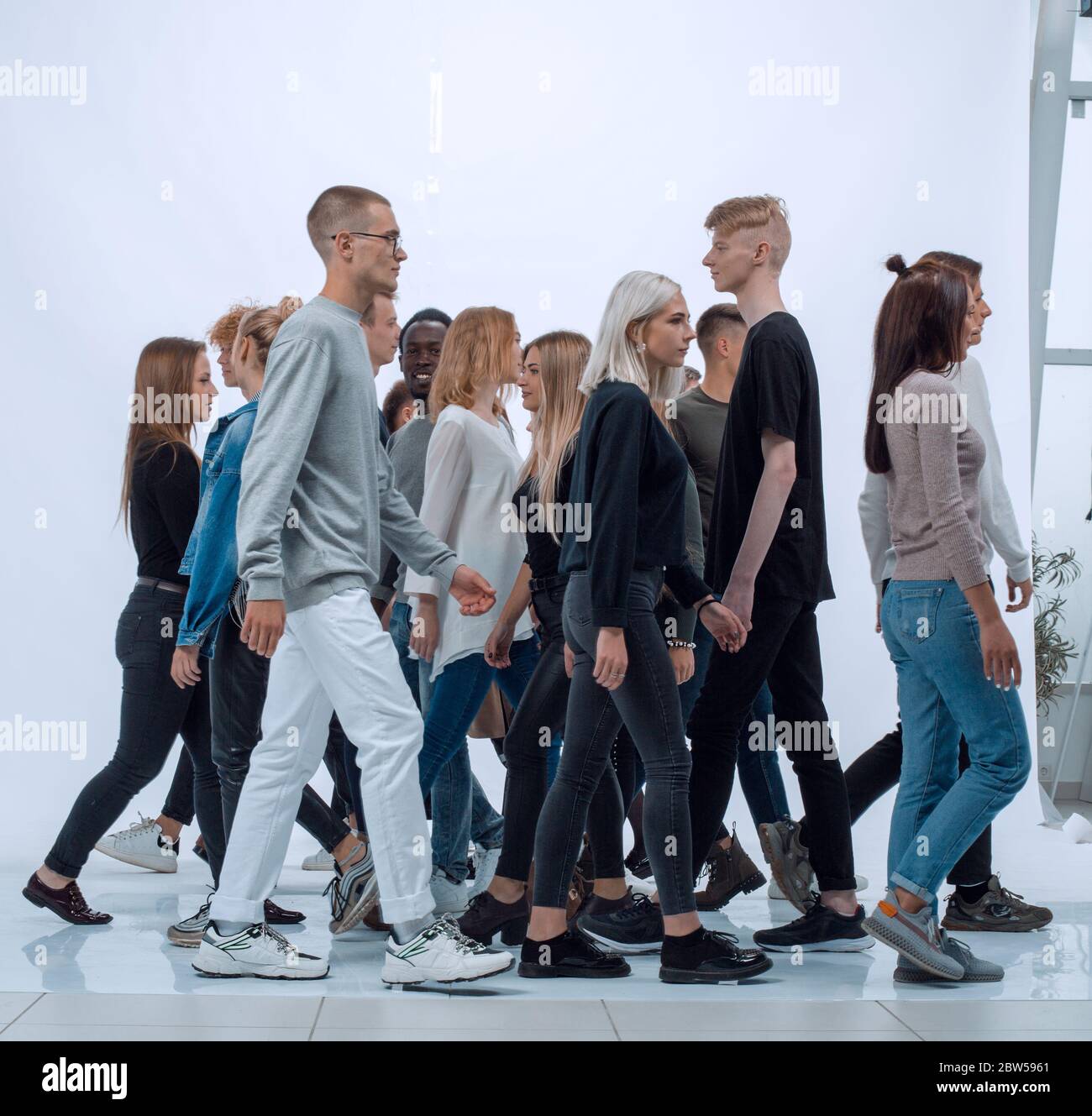 casual young people walking in different directions Stock Photo - Alamy