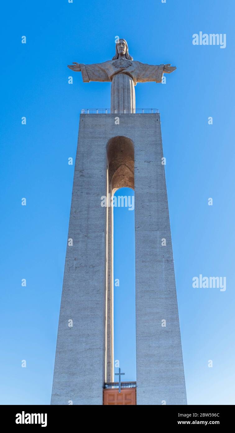 Front view of sculpture of Jesus Christ with clear, blue sky on a ...
