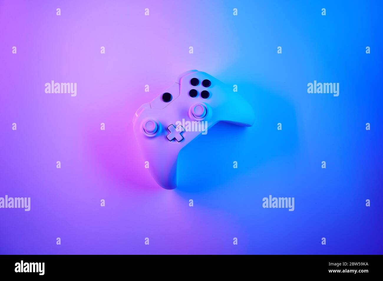 Gamepad in violet snd blue neon colors. Gamer concept Stock Photo - Alamy