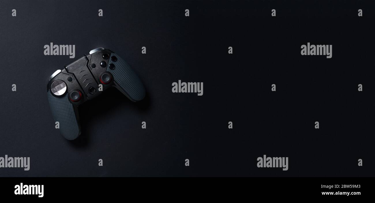 Black gamepad on black background. Gamer concept Stock Photo - Alamy
