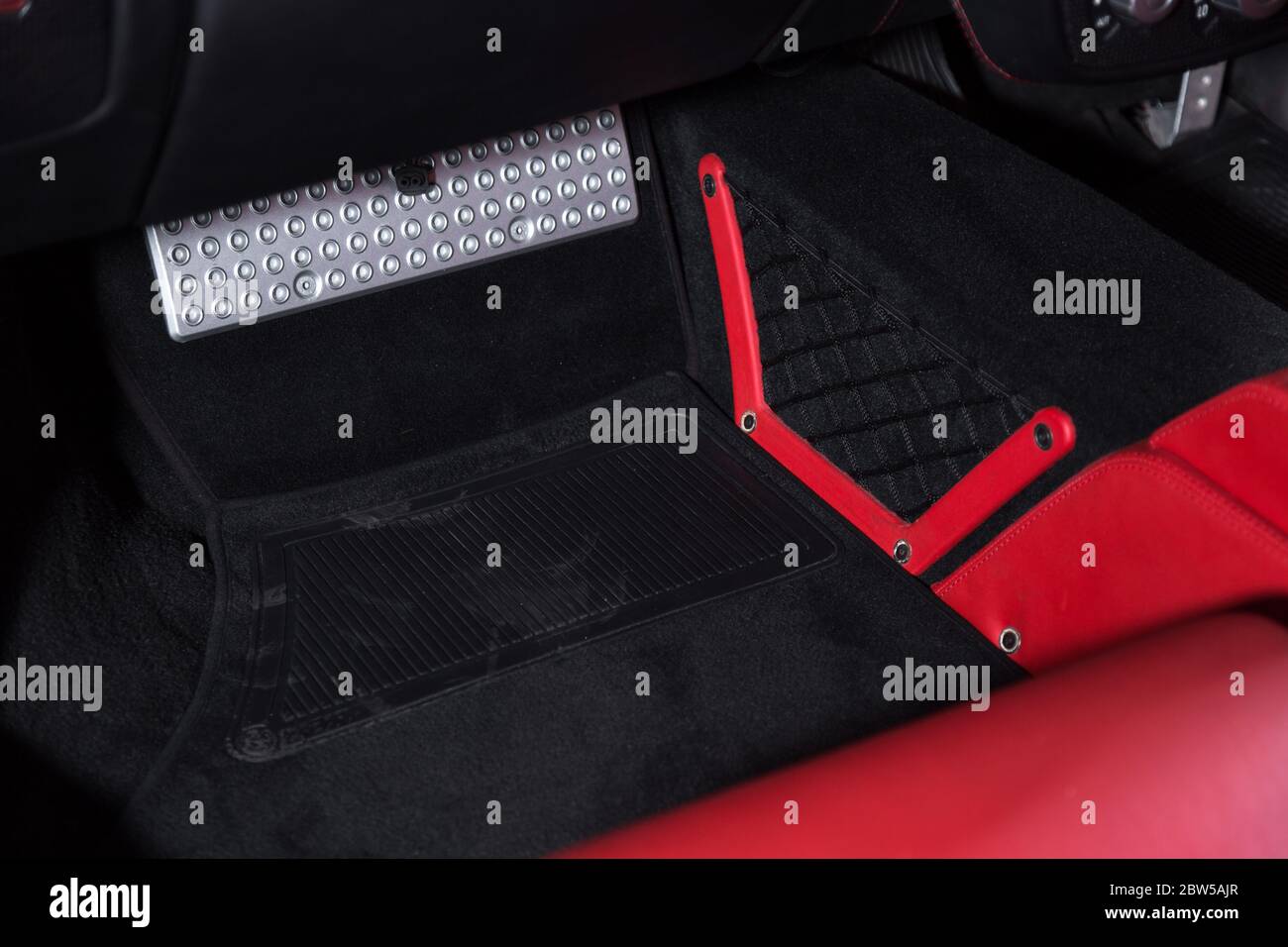 Detail shot of leg rest space in sports car Stock Photo - Alamy