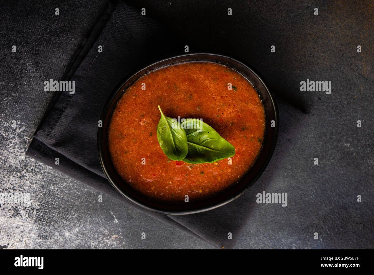 Traditional spanish tomato soup Gazpacho derved in ceranic bowl with ...