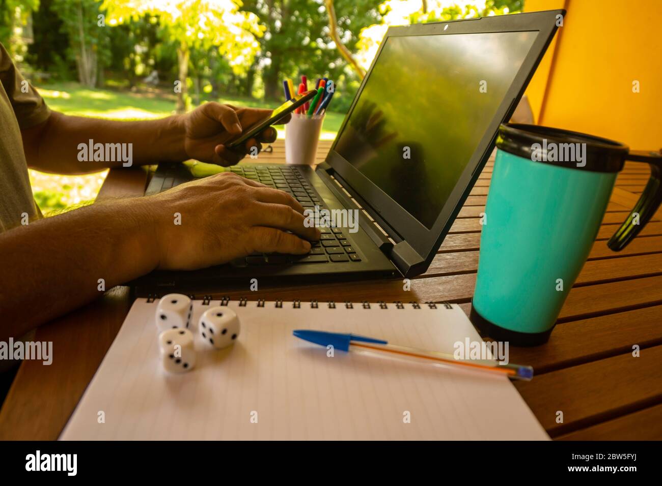 Man doing computer work from home during quarantine. Social isolation ...