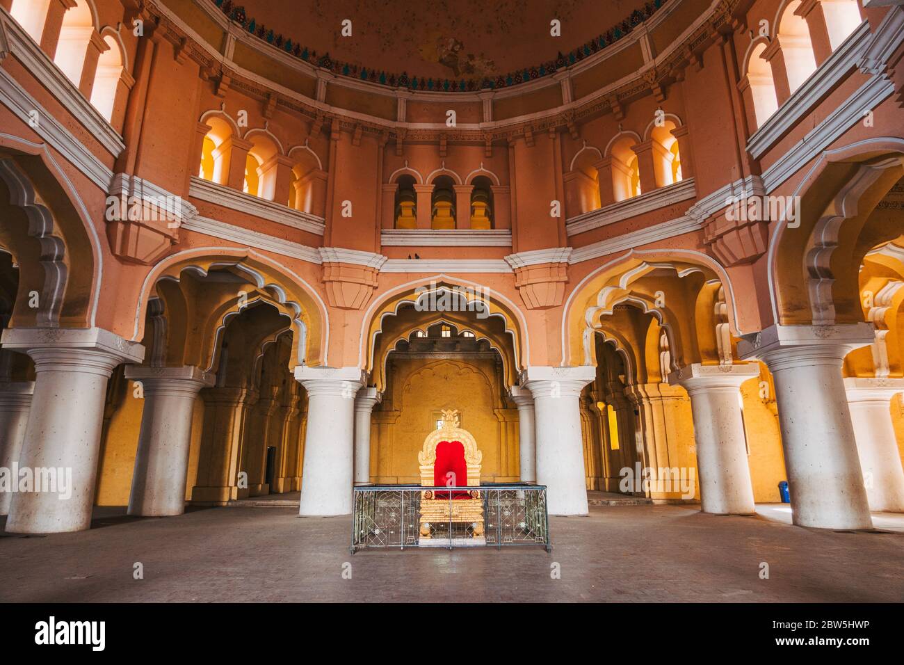 A replica throne surrounded by ornate arches in Thirumalai Nayakkar ...
