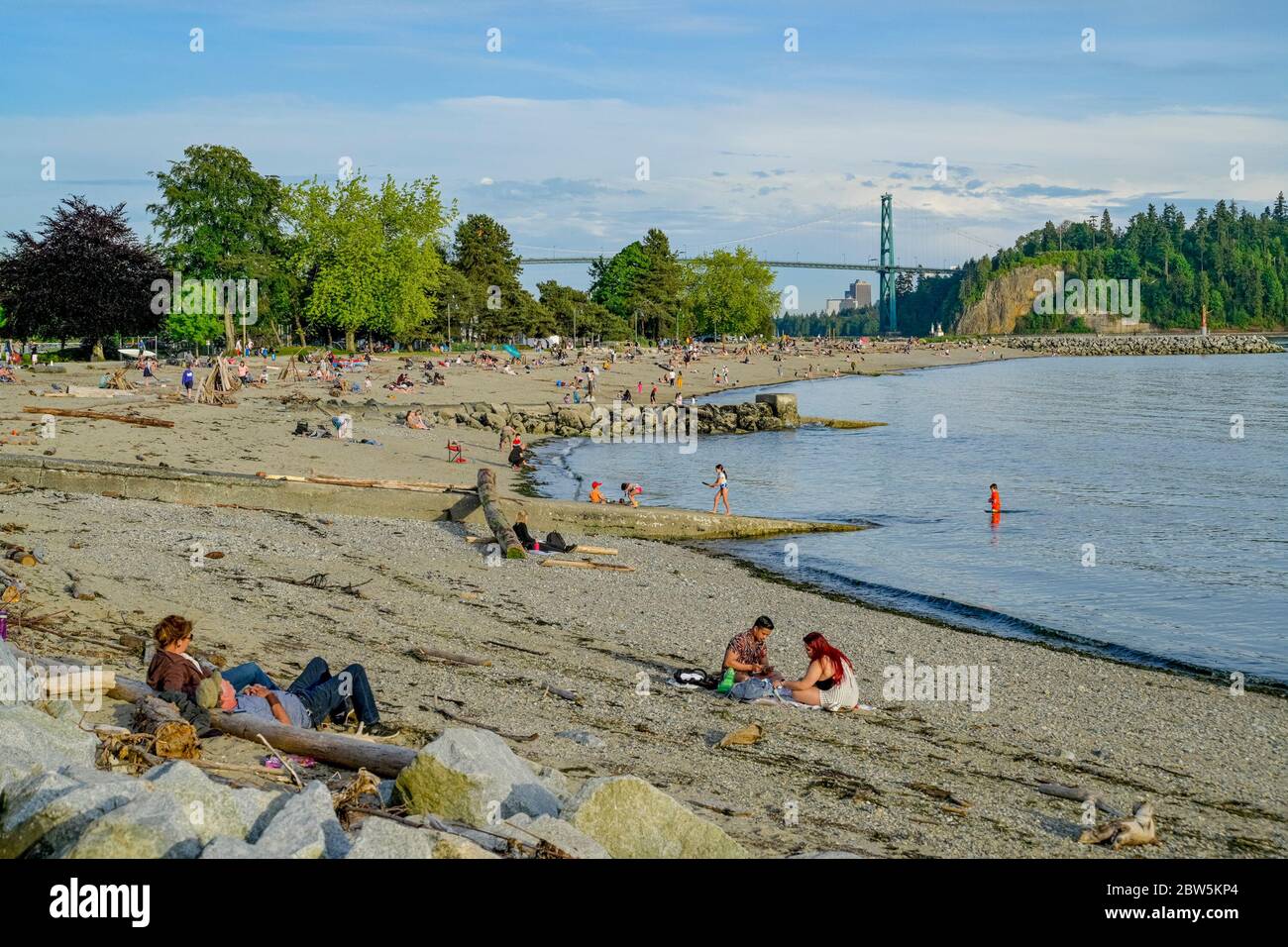 People enjoying warm Spring day at the beach, Ambleside Park, West ...