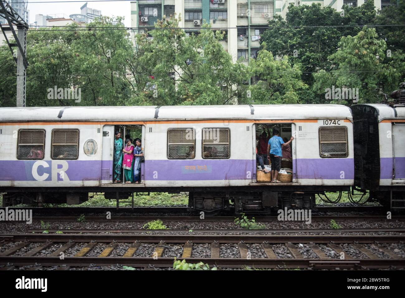 Passengers on crowded Mumbai commuter train. Mumbai, India Stock Photo ...