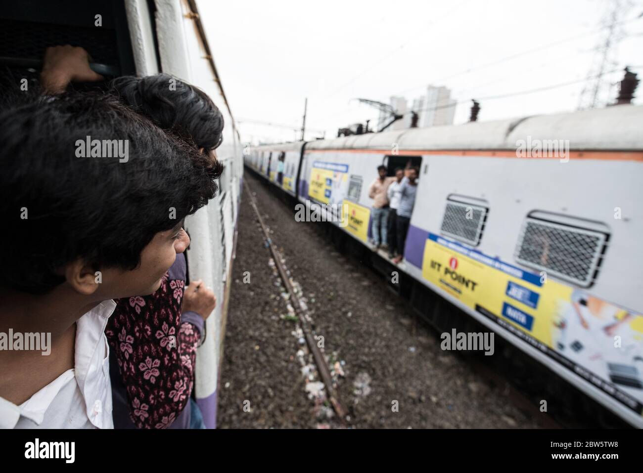 Passengers on crowded Mumbai commuter train. Mumbai, India Stock Photo ...