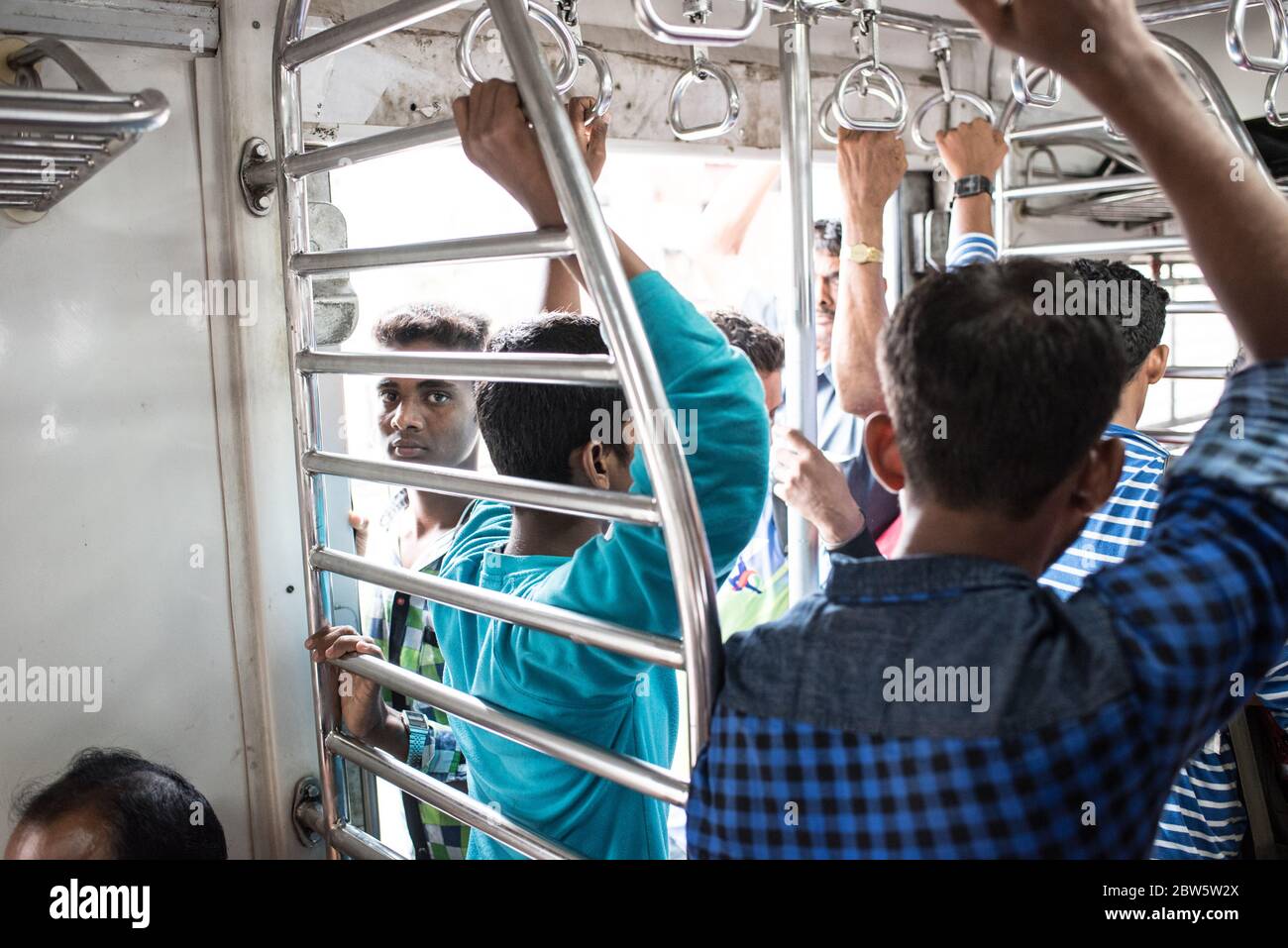Passengers on crowded Mumbai commuter train. Mumbai, India Stock Photo ...