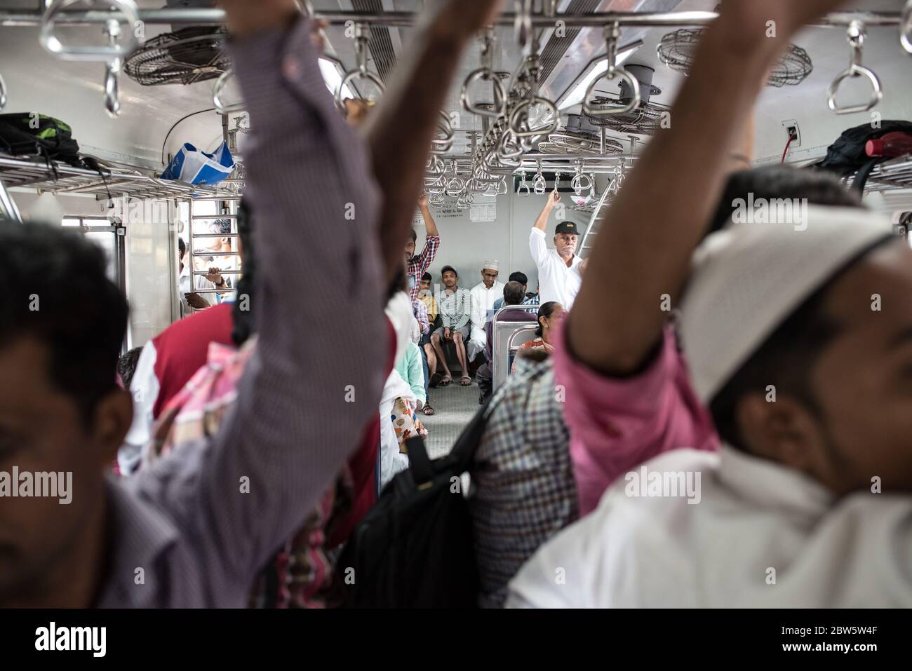 Passengers on crowded Mumbai commuter train. Mumbai, India Stock Photo ...