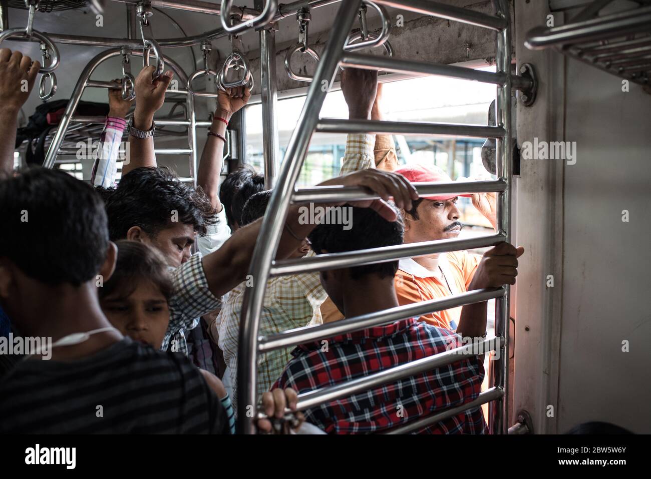 Passengers on crowded Mumbai commuter train. Mumbai, India Stock Photo ...