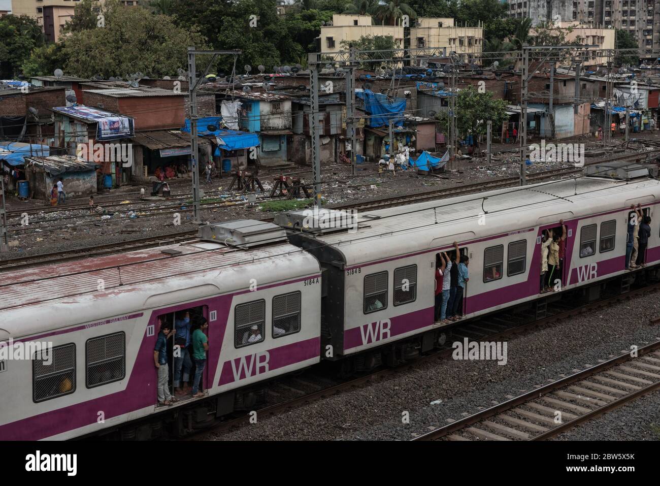 Passengers on crowded Mumbai commuter train. Mumbai, India Stock Photo ...