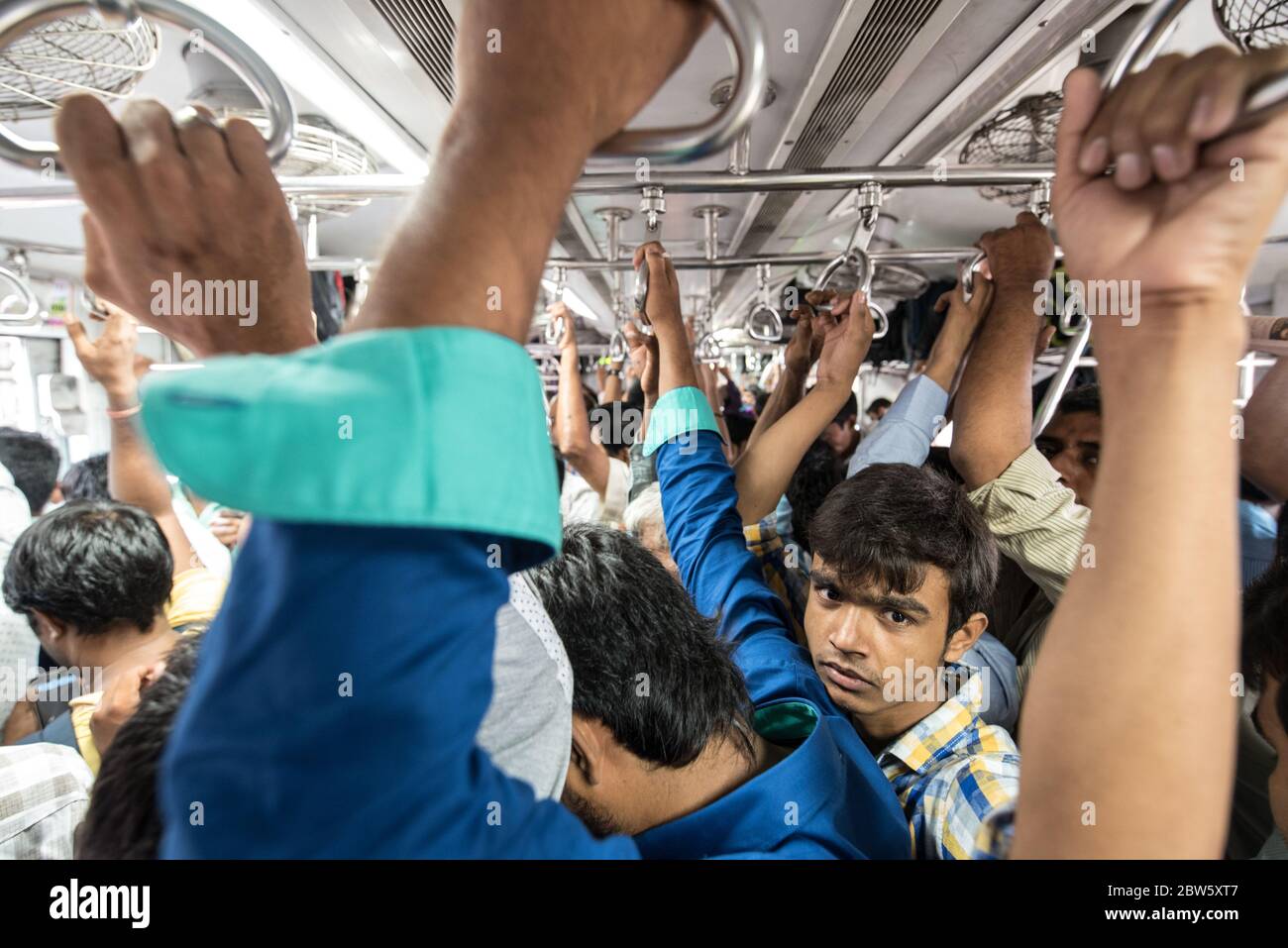 Passengers on crowded Mumbai commuter train. Mumbai, India Stock Photo ...