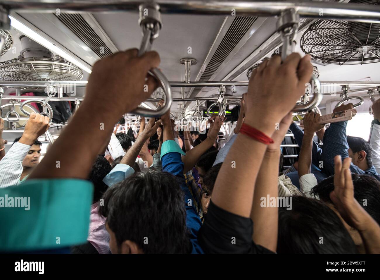 Passengers on crowded Mumbai commuter train. Mumbai, India Stock Photo ...