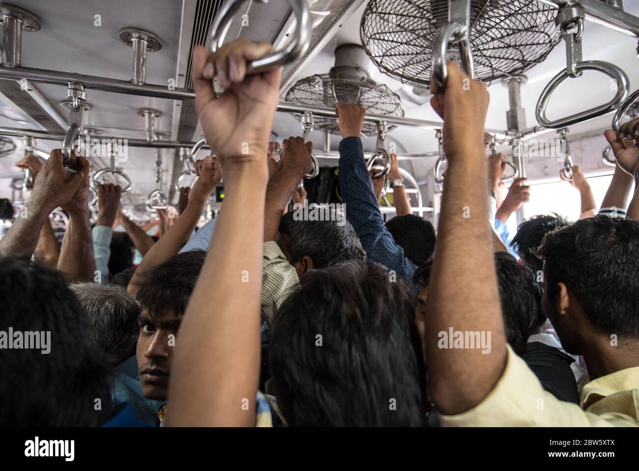 Passengers on crowded Mumbai commuter train. Mumbai, India Stock Photo ...