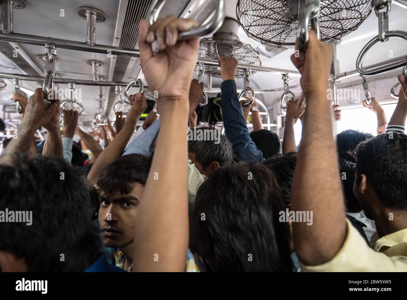 Passengers on crowded Mumbai commuter train. Mumbai, India Stock Photo ...