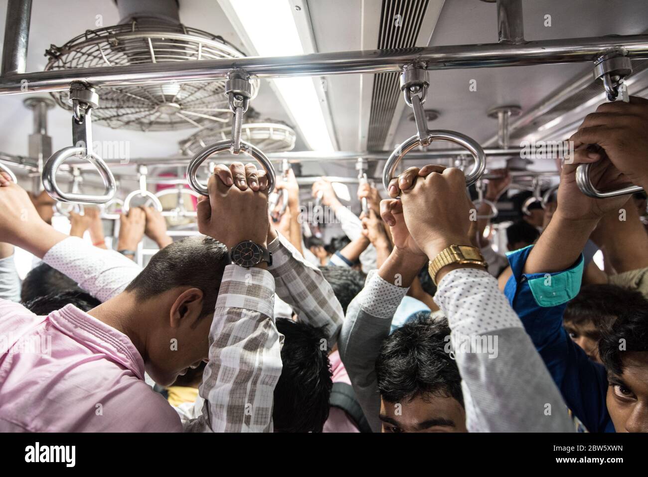 Passengers on crowded Mumbai commuter train. Mumbai, India Stock Photo ...