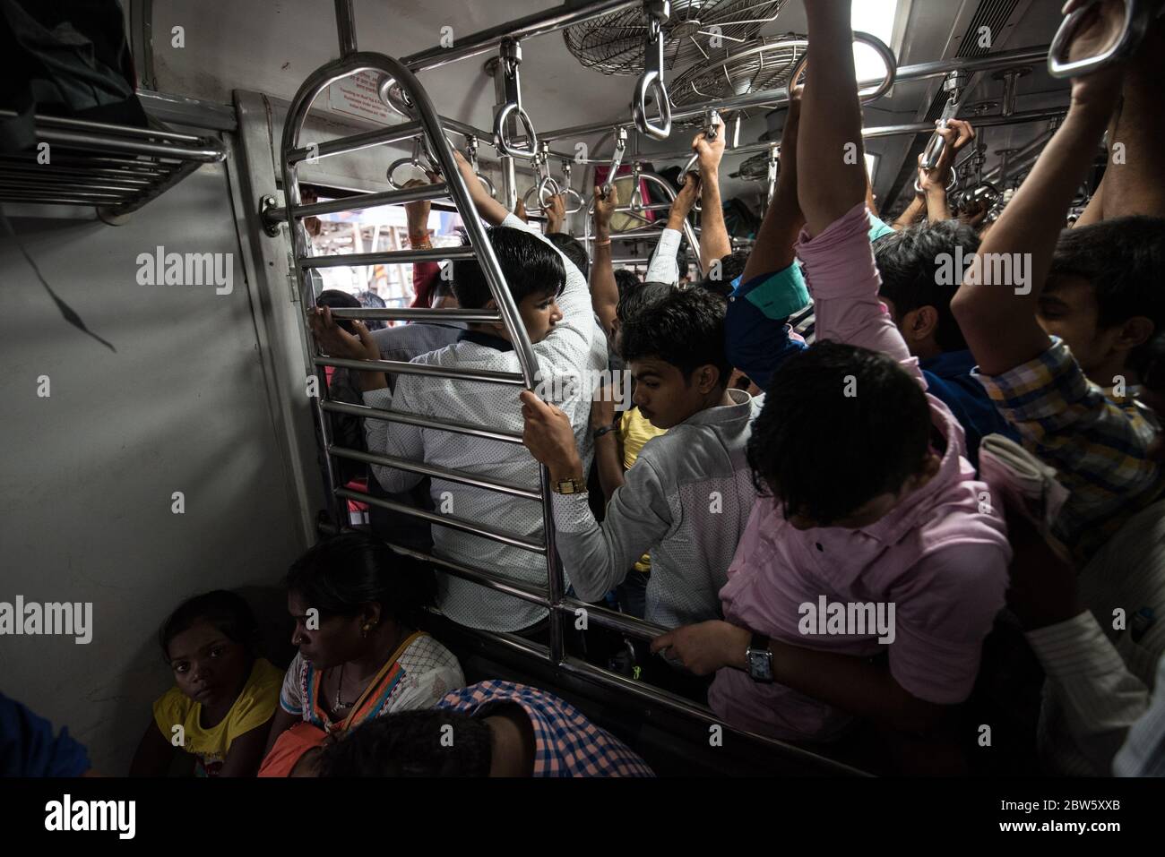 Passengers on crowded Mumbai commuter train. Mumbai, India Stock Photo ...