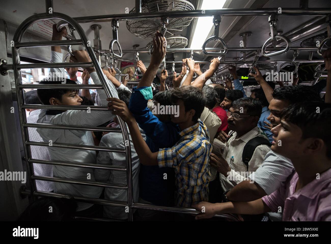 Passengers on crowded Mumbai commuter train. Mumbai, India Stock Photo ...
