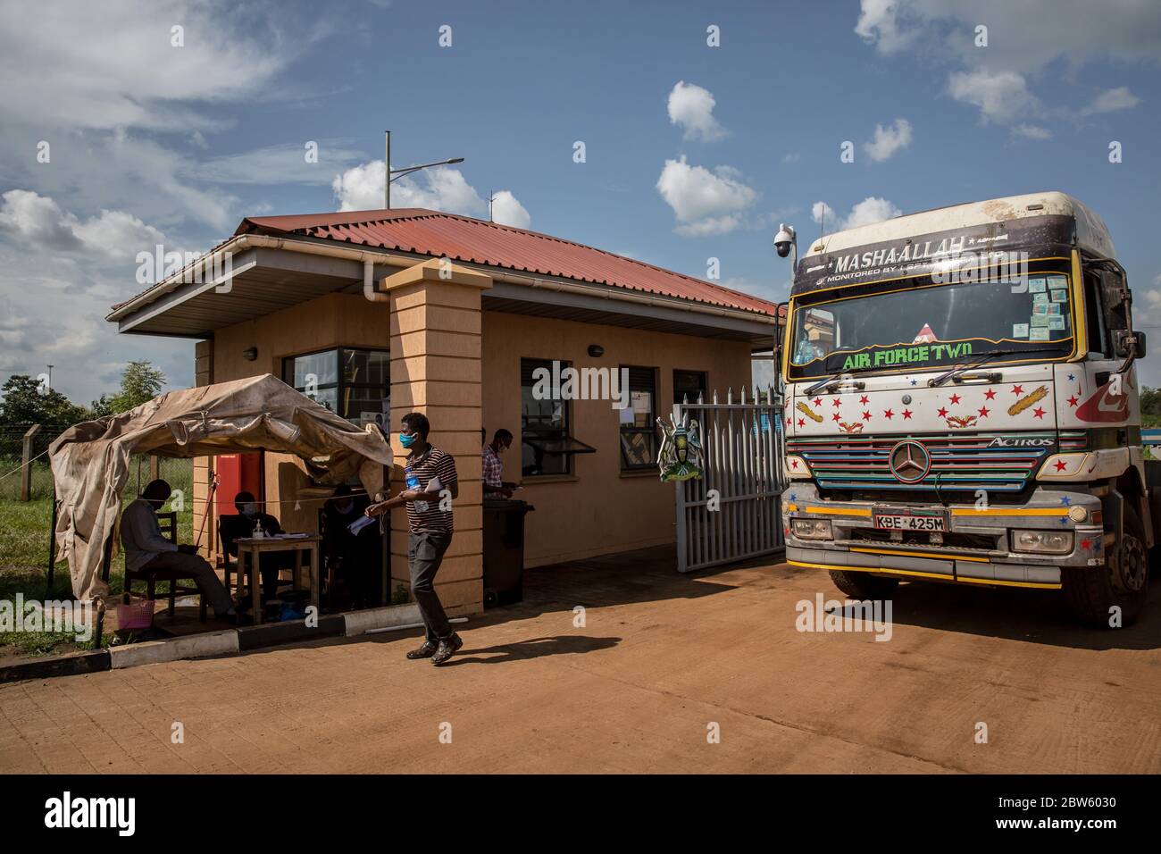 Elegu, Uganda. 28th May, 2020. A truck enters a checkpoint at the Elegu ...