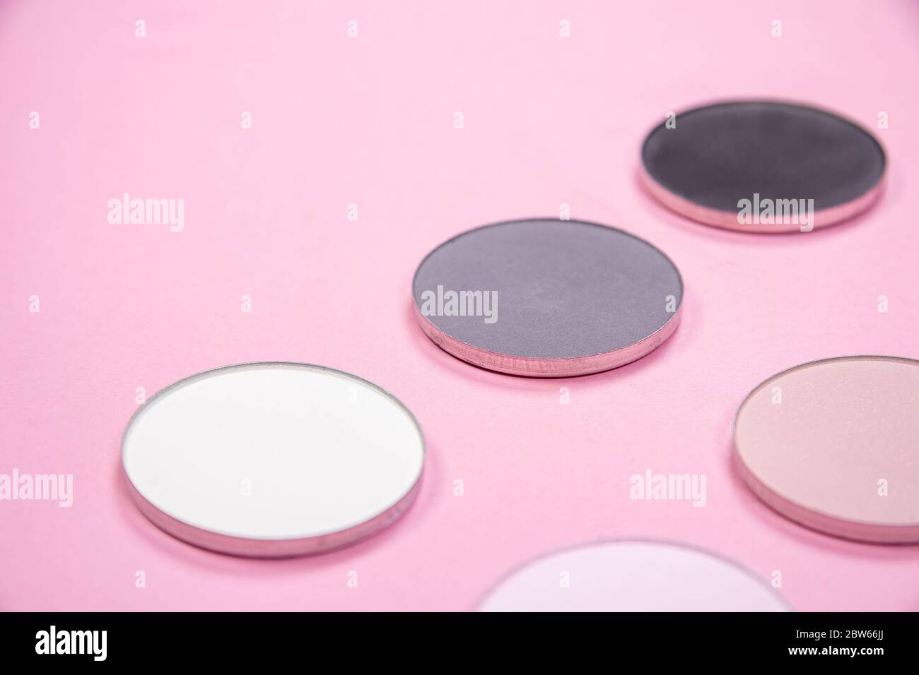Pattern of eye shadows of different colors on a pink background Stock ...