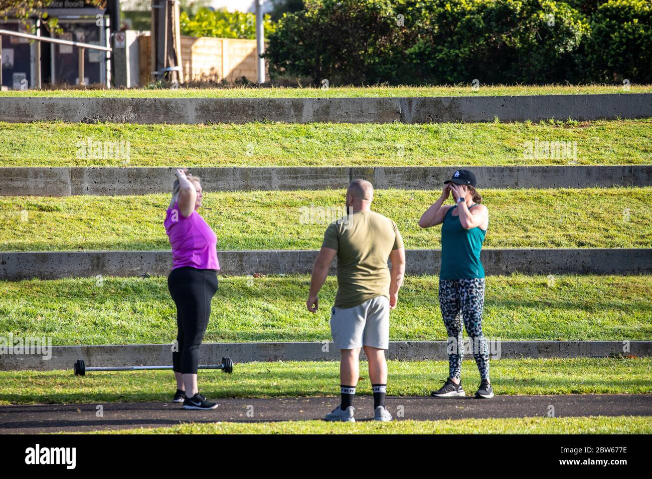 Australia nwomen exercising outdoors in a Sydney park with their ...
