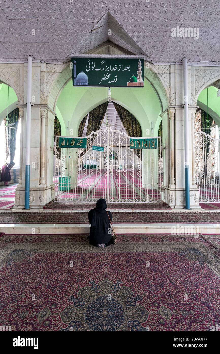 A muslim woman offers prayers at the famous Hazratbal shrine in ...