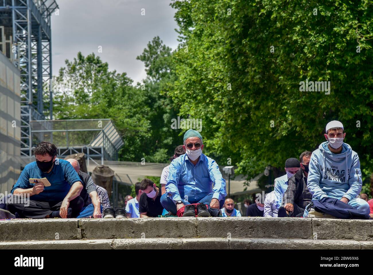 Praying with medical masks outside of the Blue Mosque. First Friday ...