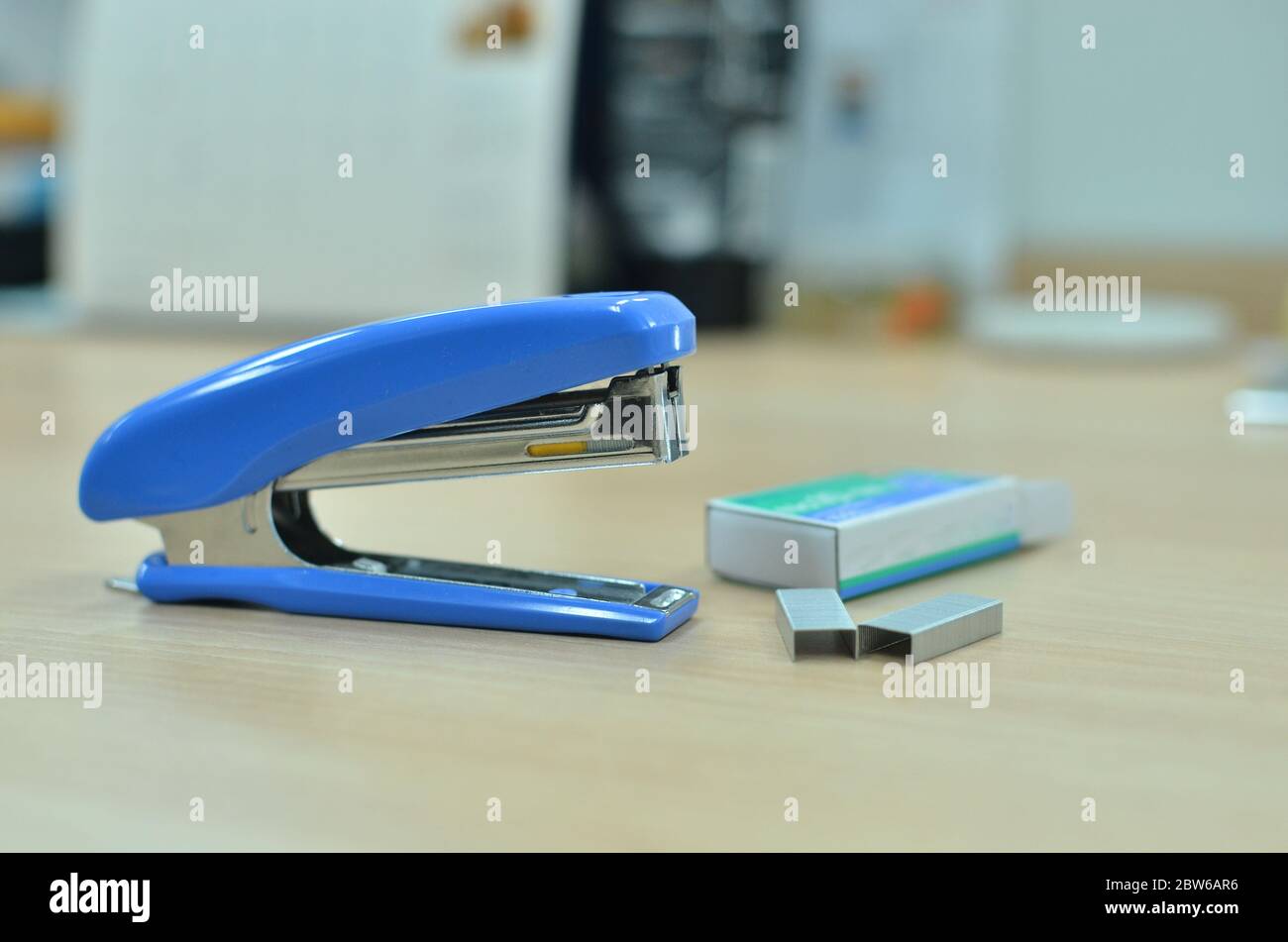 Office Stapler on desk background Stock Photo - Alamy