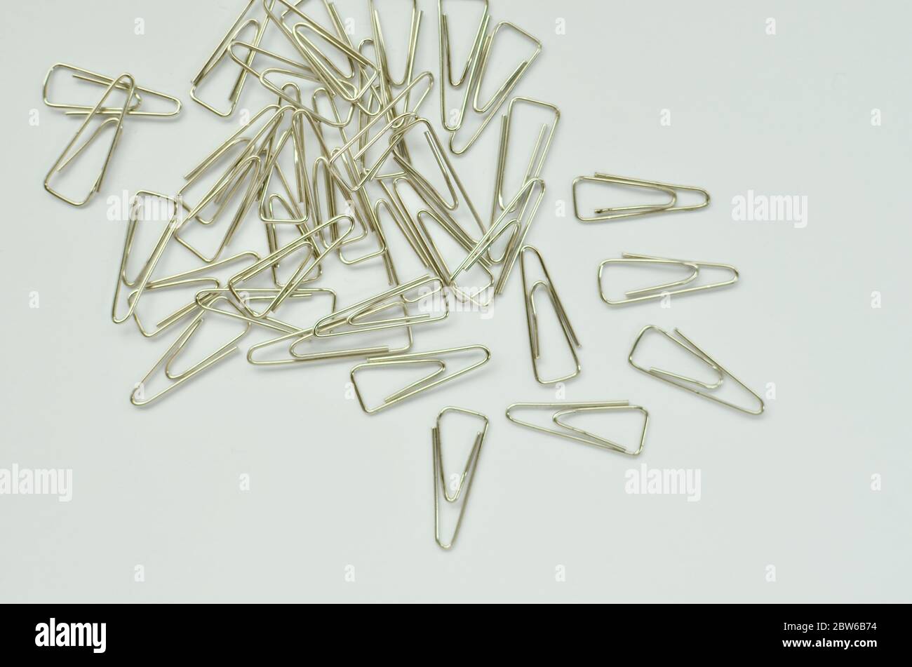 Office, paper clip on white background Stock Photo - Alamy