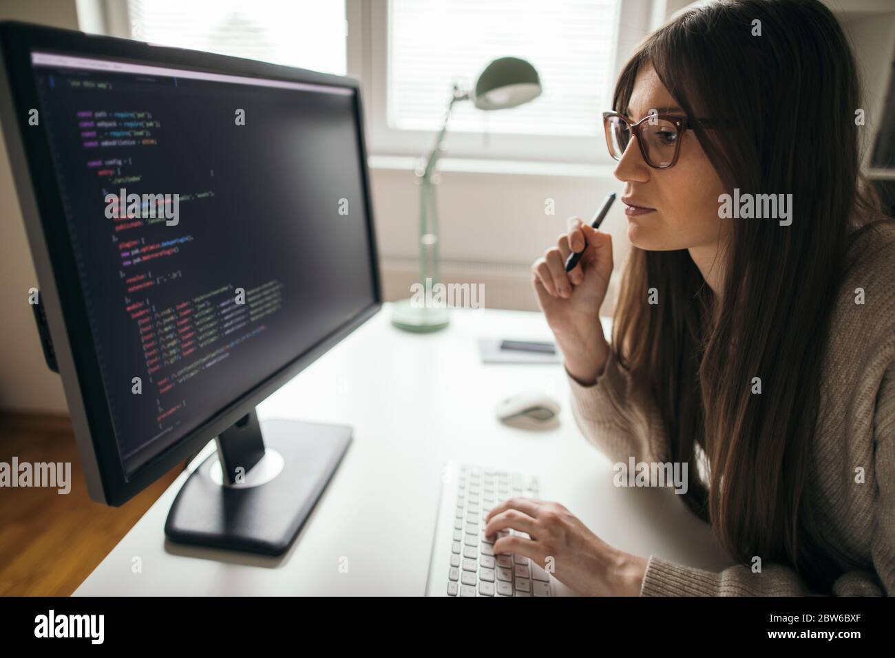 Programming codes female hi-res stock photography and images - Alamy