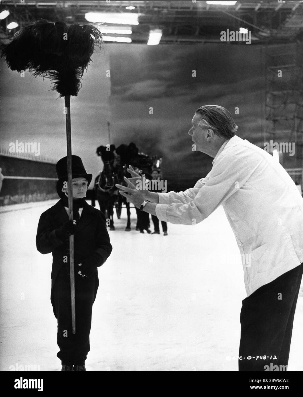 Director CAROL REED on set candid with MARK LESTER as Oliver Twist at ...